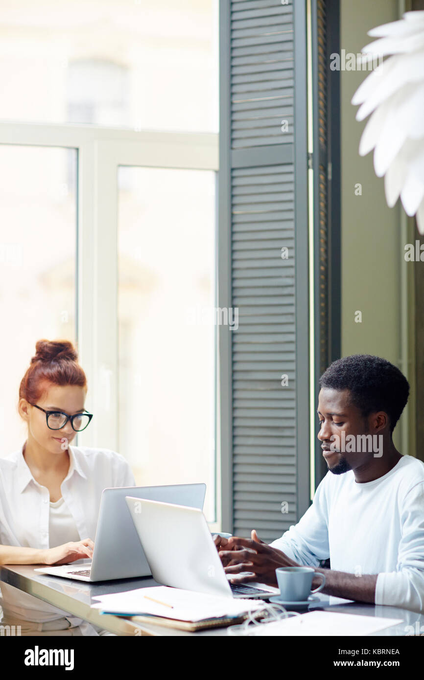 Focused young businesswoman typing hi-res stock photography and images ...