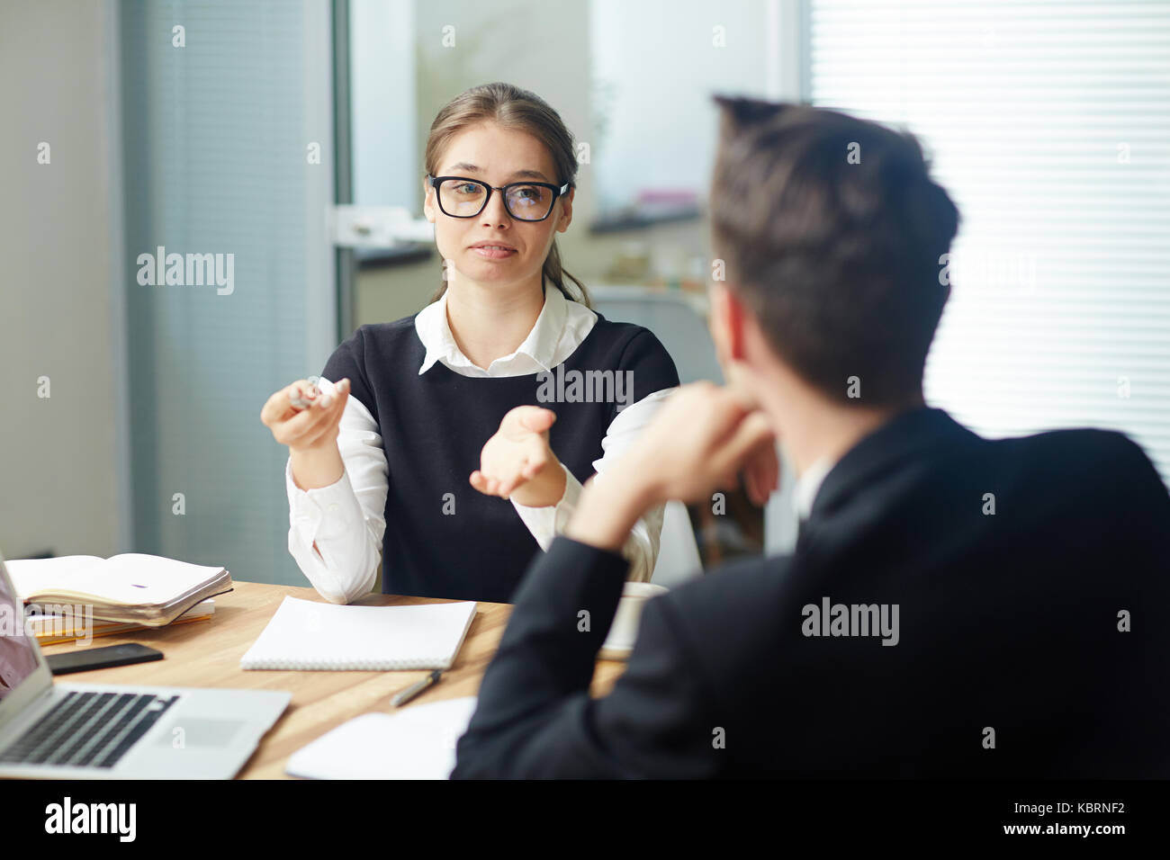 Conversation of managers Stock Photo - Alamy