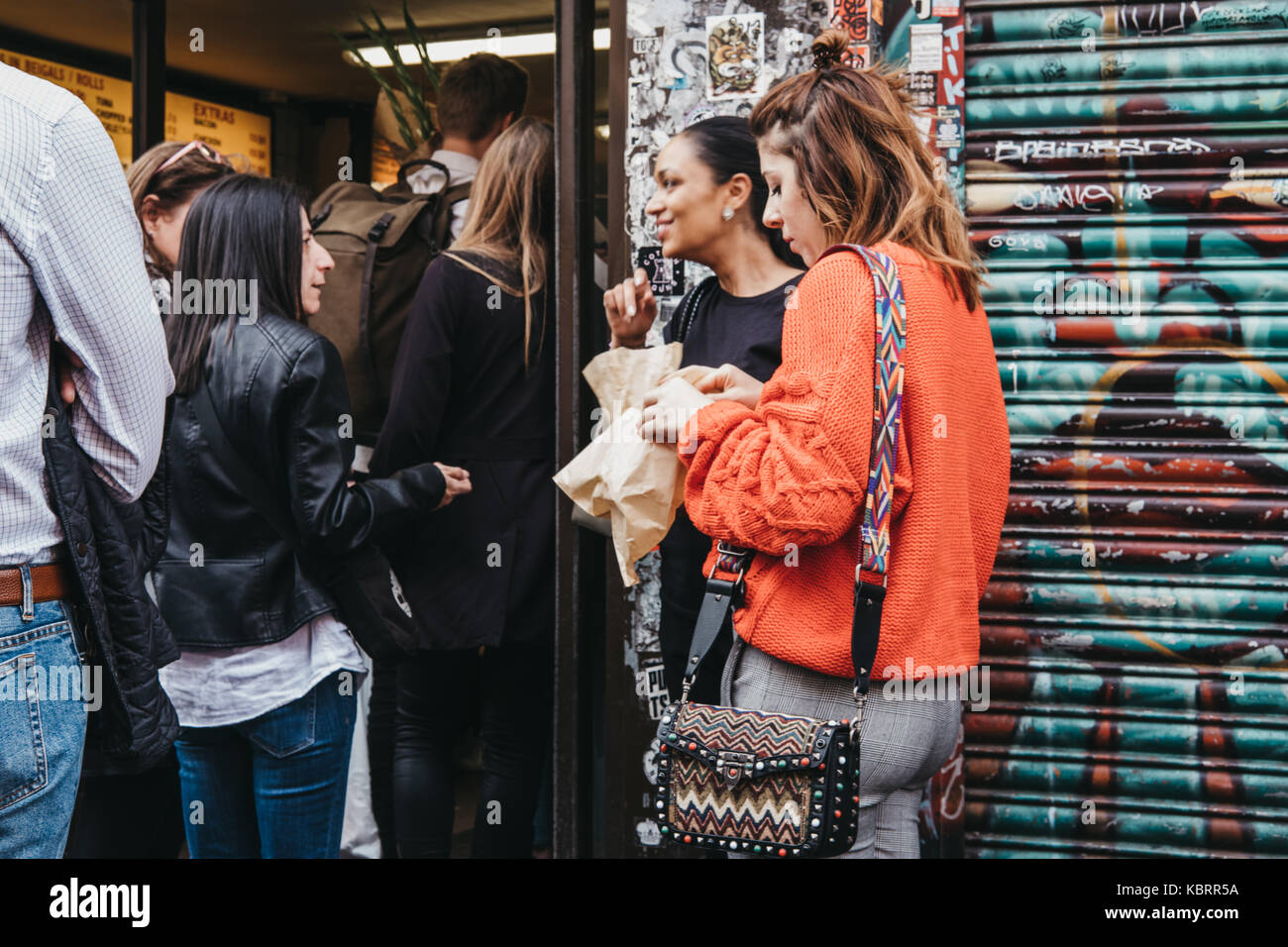 People queuing outside a restaurant hi-res stock photography and images ...