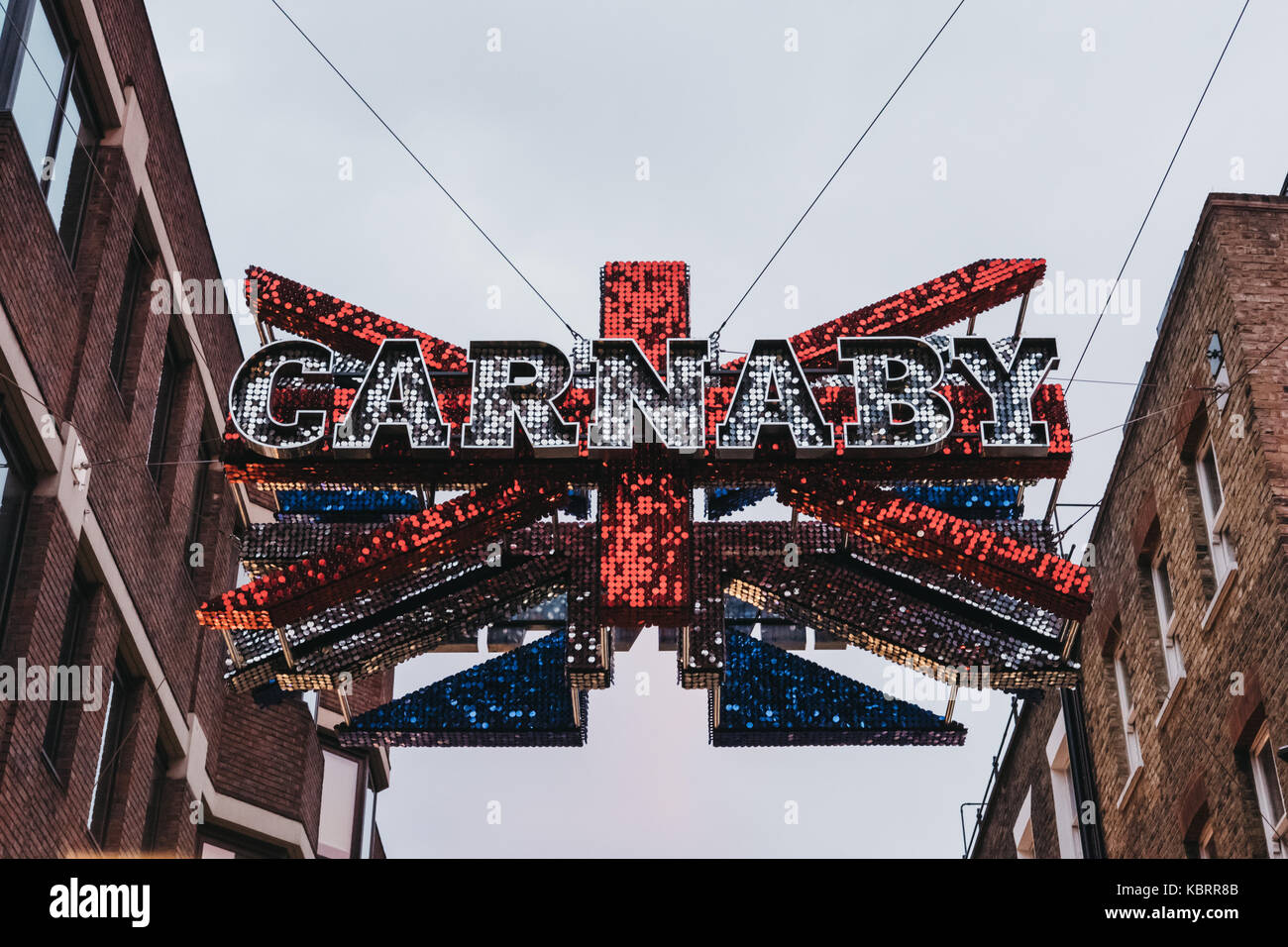 Large Carnaby and Union Jack 3D shimmer sign over the junction between ...