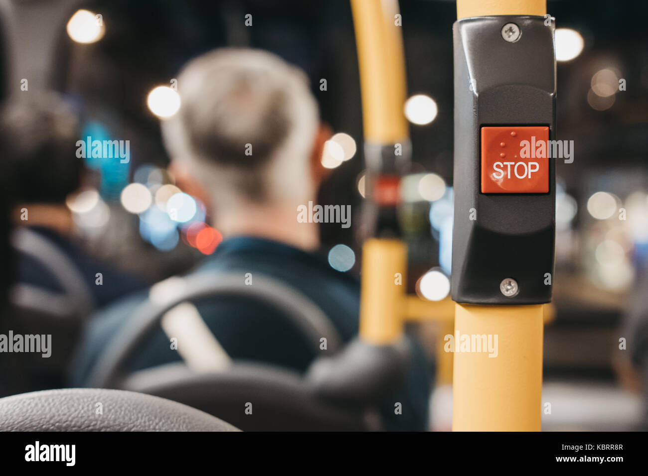 Close up of the red STOP button inside double decker bus in London ...