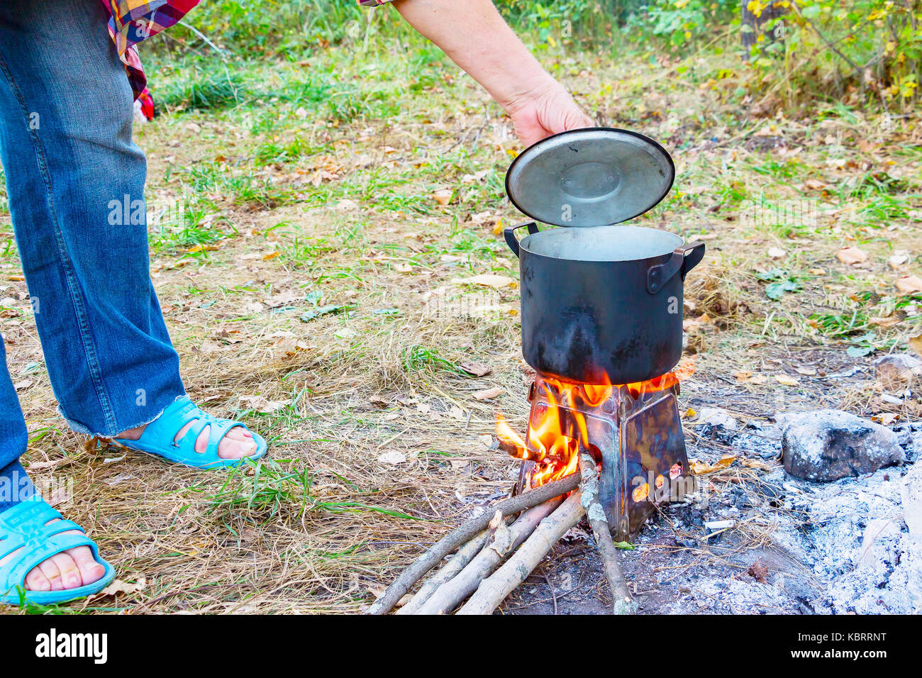 Smoked pot on a camp stove Stock Photo - Alamy