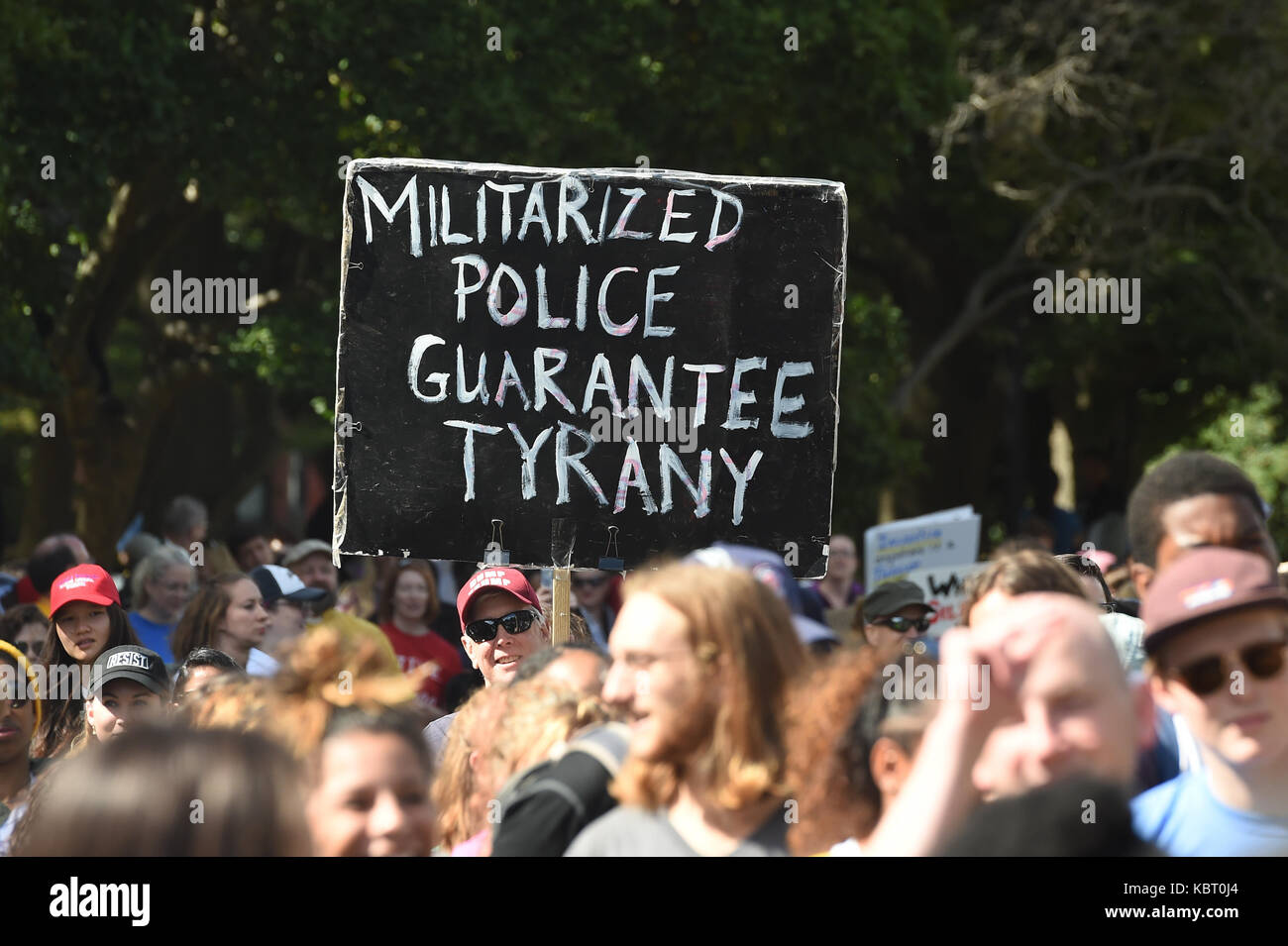 Washington, DC, USA. 30th Sep, 2017. Marchers carry their signs into ...
