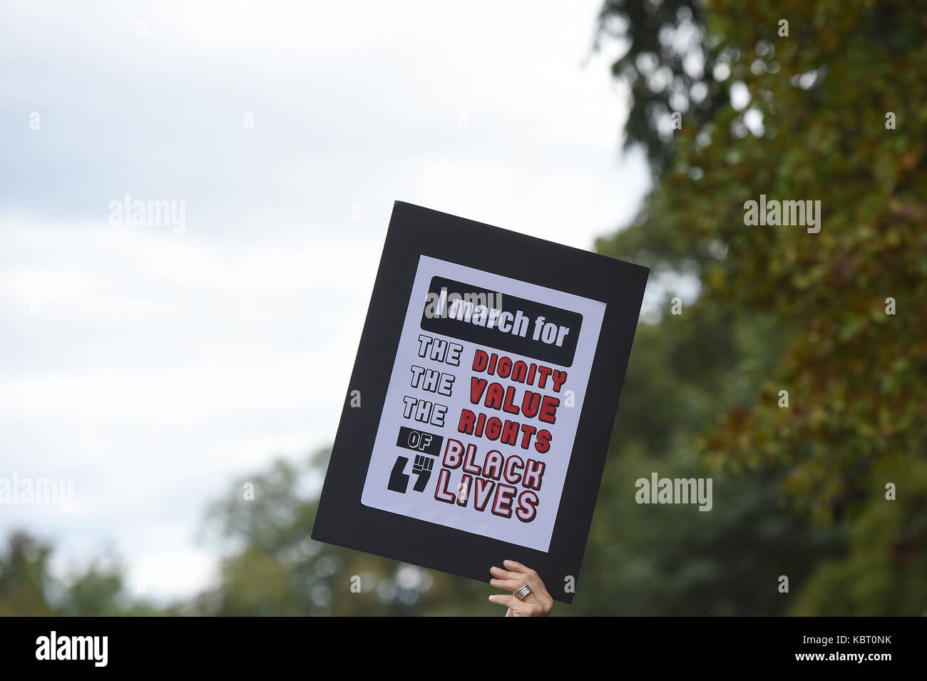Washington, DC, USA. 30th Sep, 2017. Marchers hold their signs high in ...