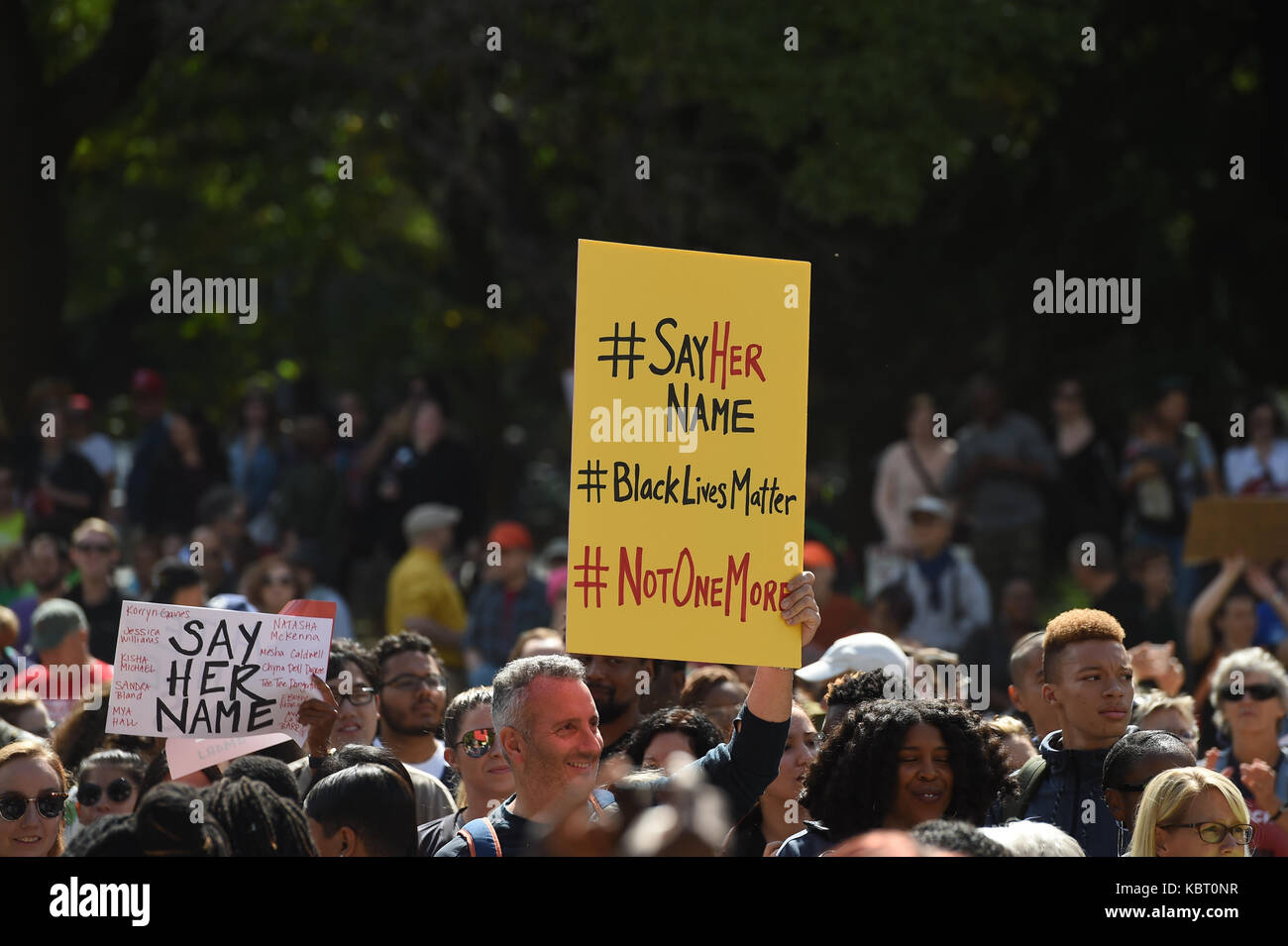 Washington, DC, USA. 30th Sep, 2017. Marchers hold their signs high in ...