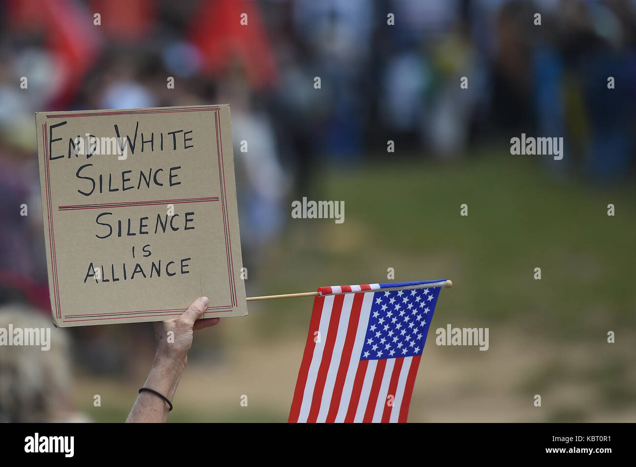 Washington, DC, USA. 30th Sep, 2017. Marchers hold their signs high in ...
