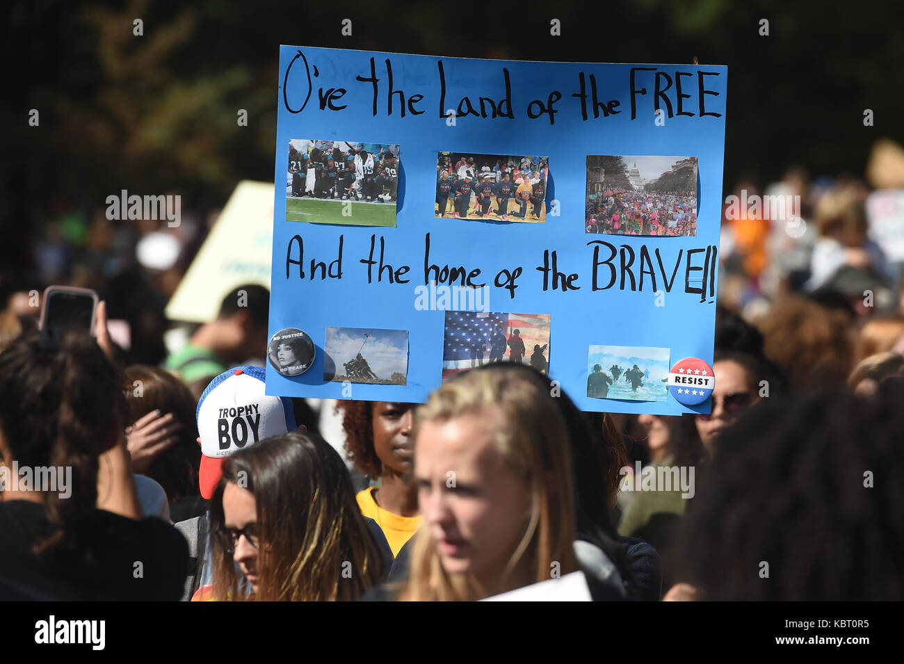 Washington, DC, USA. 30th Sep, 2017. Marchers hold their signs high in ...