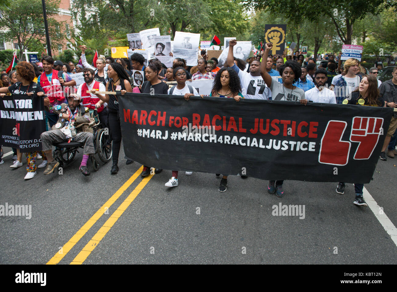 Washington, DC, USA. 30th Sep, 2017. Marchers peacefully march down ...