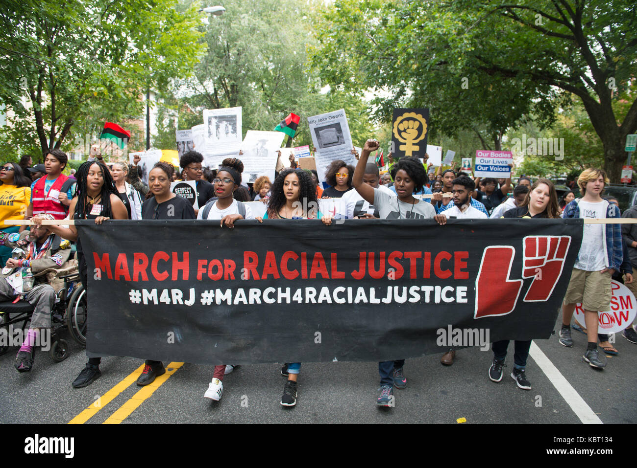 Washington, DC, USA. 30th Sep, 2017. Marchers peacefully march down ...