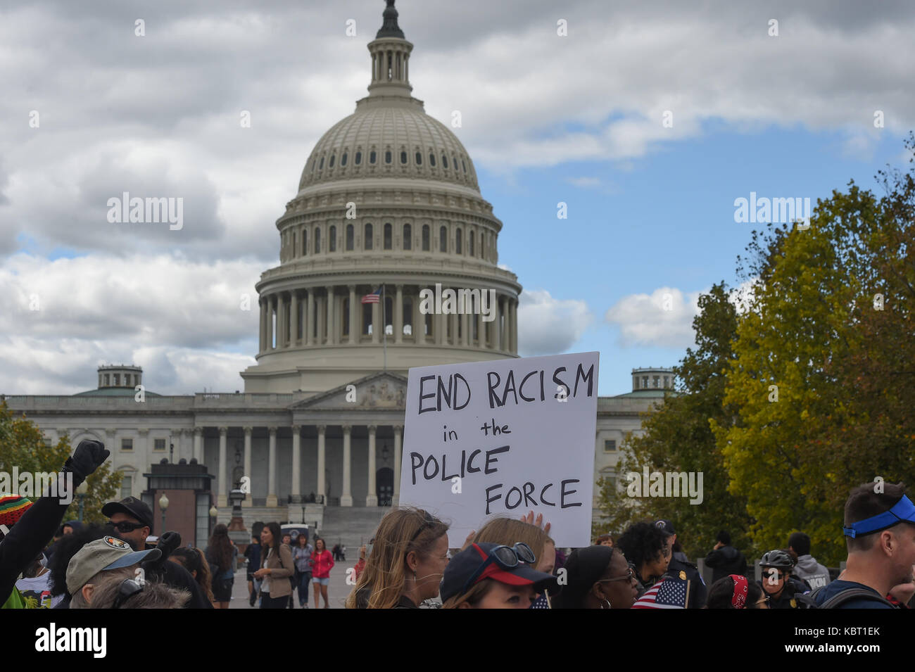 Washington, DC, USA. 30th Sep, 2017. Marchers with signs march with the ...