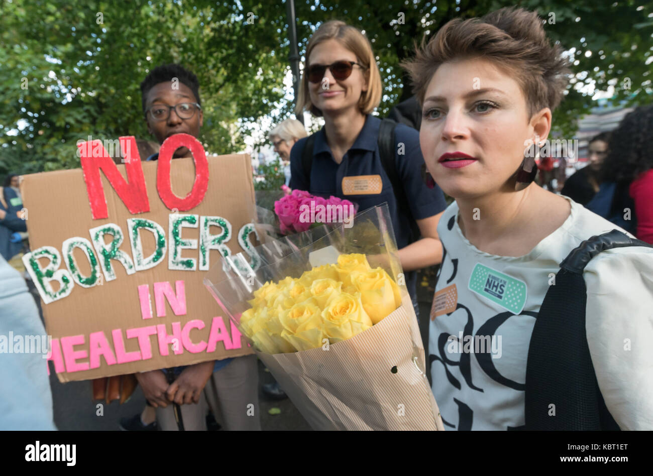 London, UK. 30th September, 2017. Protesters with flowers on the ...