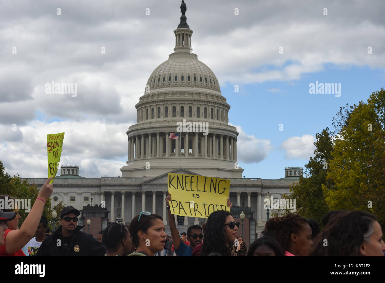 Washington, DC, USA. 30th Sep, 2017. Marchers with signs march with the ...