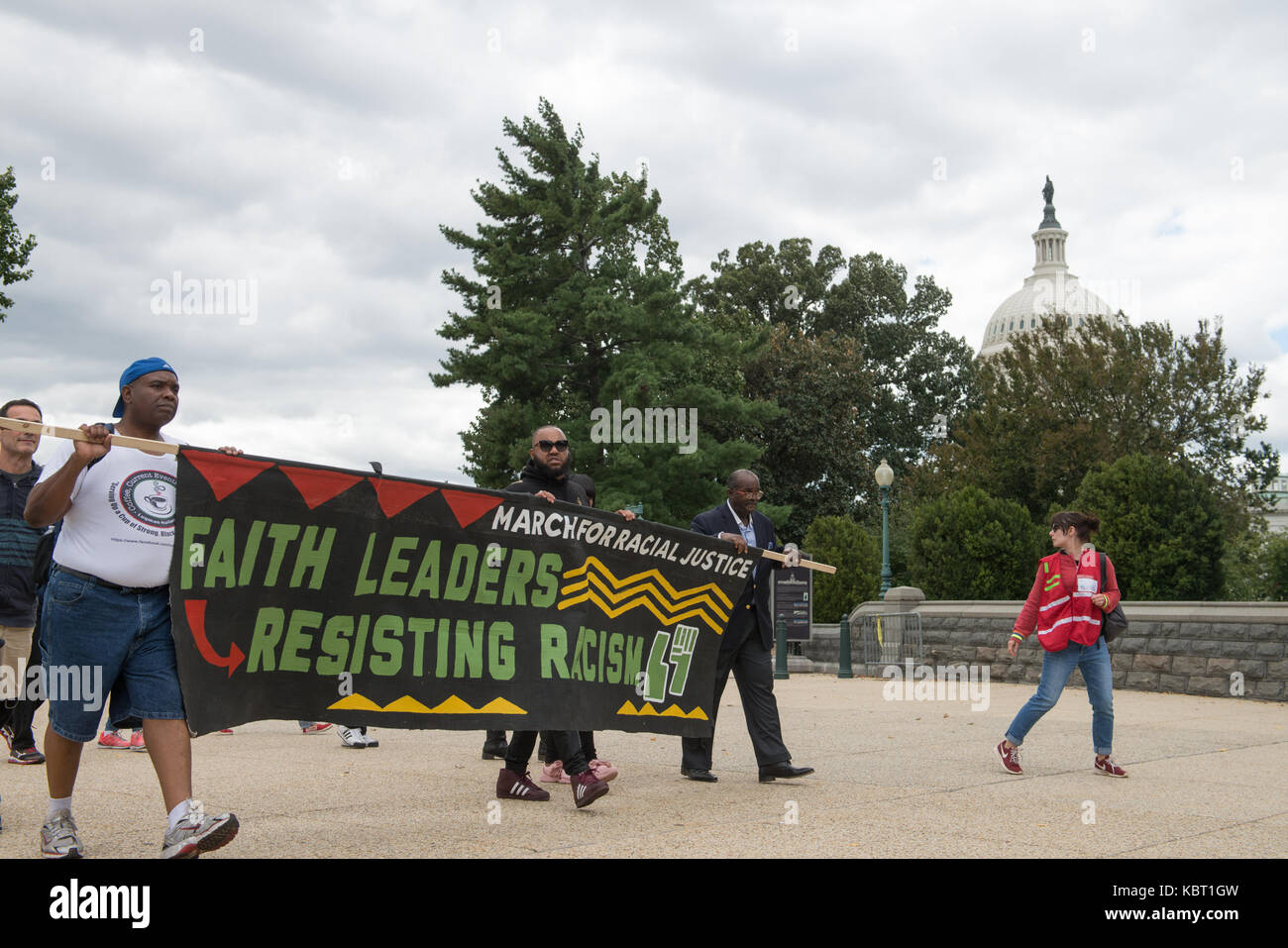 Washington, DC, USA. 30th Sep, 2017. Marchers with signs march with the ...