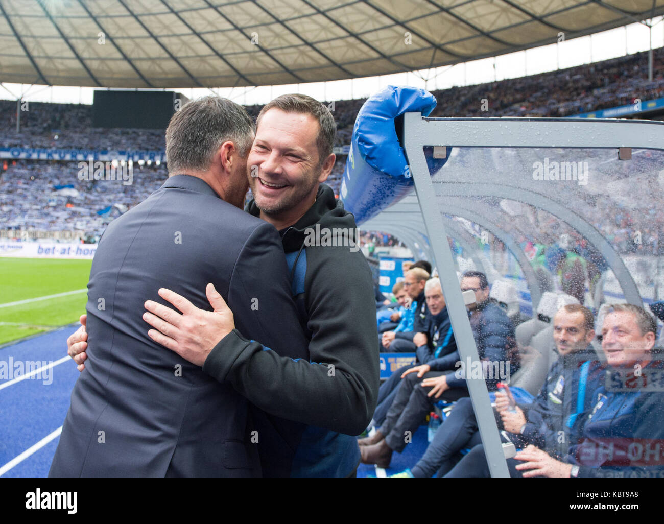 Bayern's interim coach Willy Sagnol (l) greets Berlin coach Pal Dardai ...