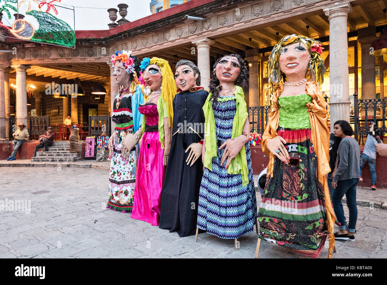 Giant paper-mache puppets called mojigangas line up for a parade during ...