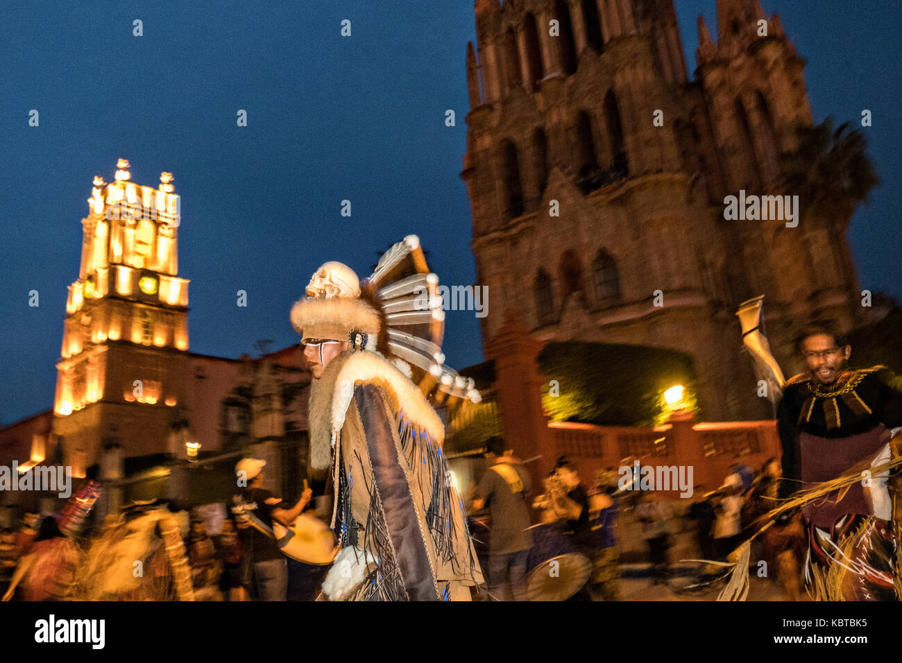 A man dressed in Native American costume performs the Concheros dance ...