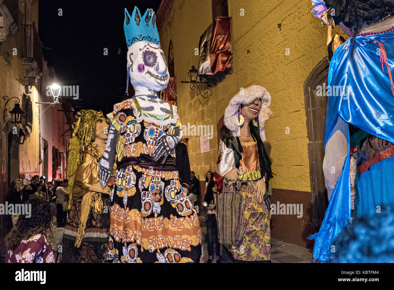 Giant paper-mache puppets called mojigangas lead a procession through ...