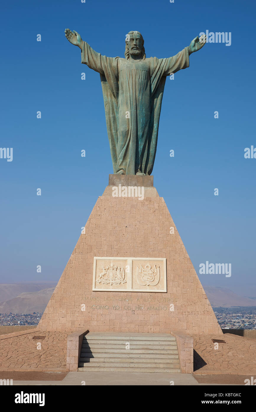Statue of Christ on the top of the Morro de Arica, a cliff that towers ...