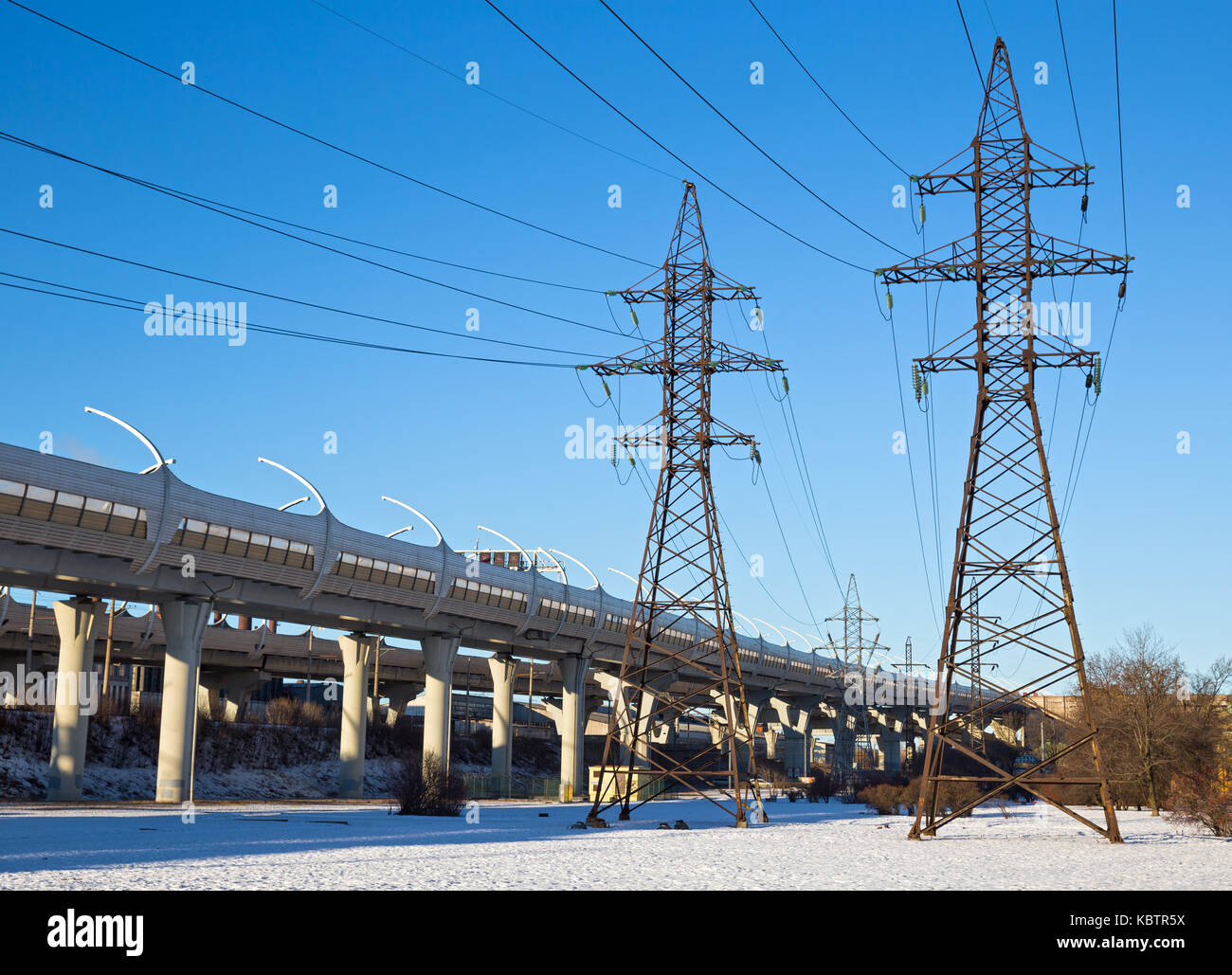 Industrial urban landscape with a transmission tower and the Western ...