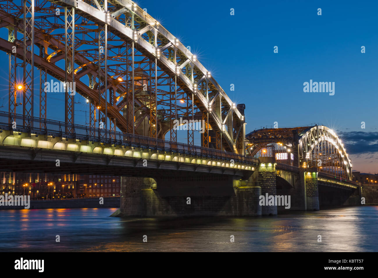 Peter the Great Bridge in Saint-Petersburg with lights in the summer ...