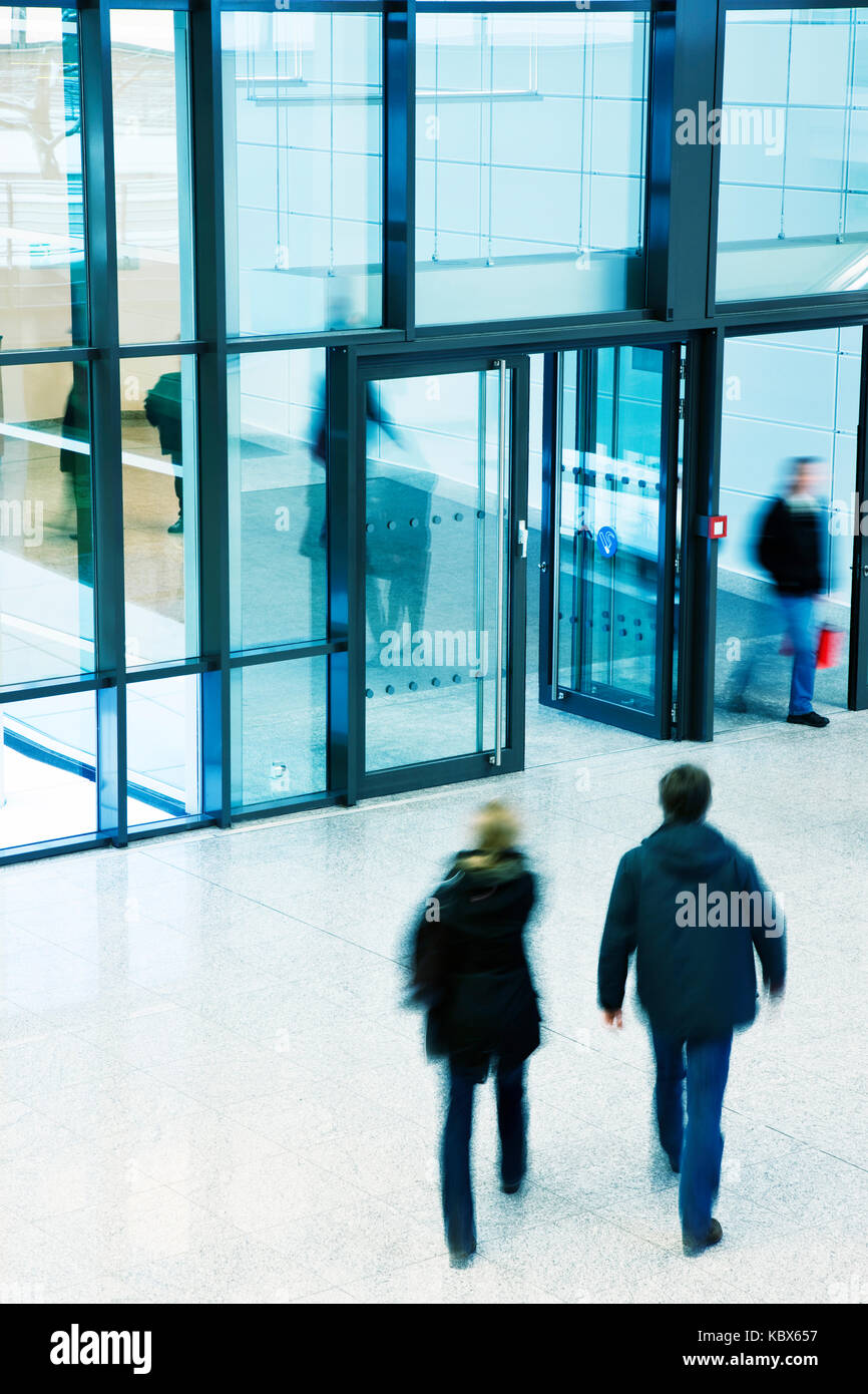 Rushing people, blue toned image Stock Photo - Alamy