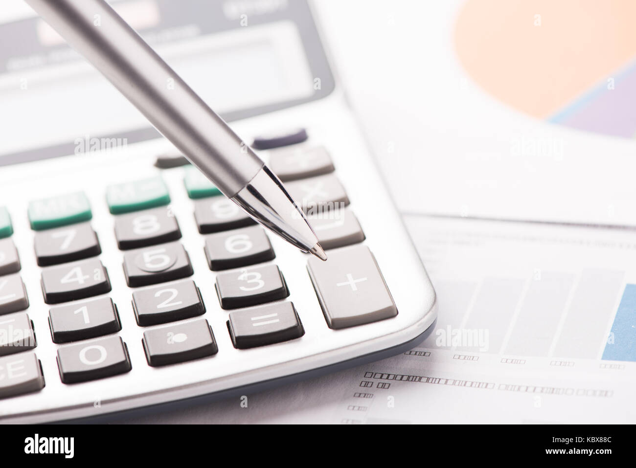 Financial statements. Business Graph. Focus on pen. Shallow depth of ...