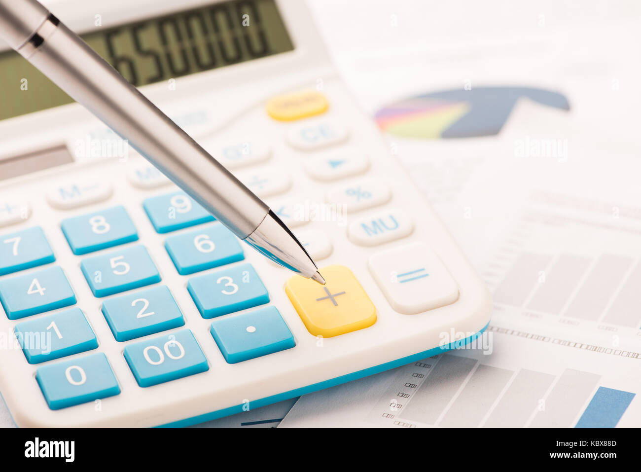 Financial statements. Business Graph. Focus on pen. Shallow depth of ...