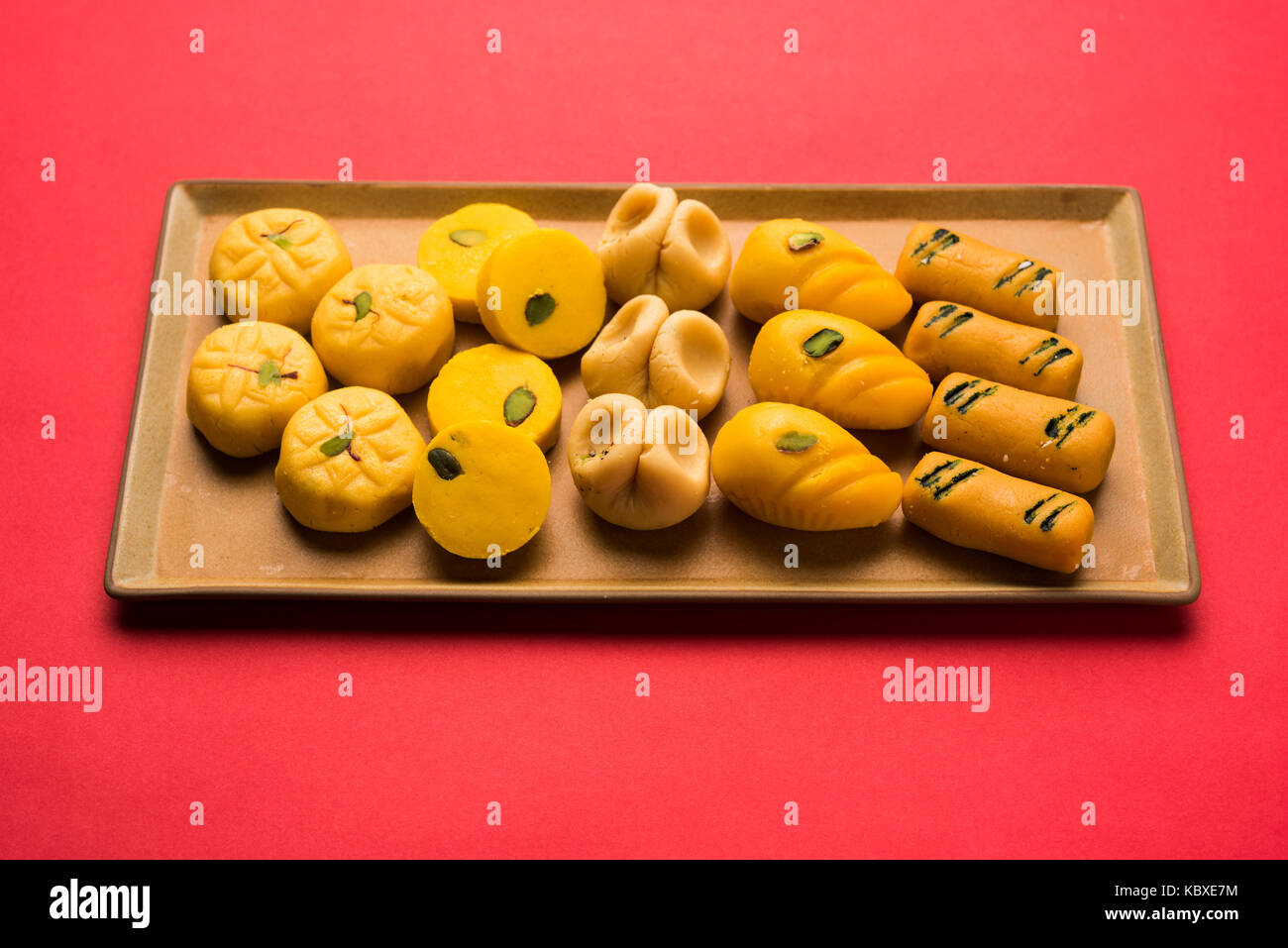stock photo of collection of variety of sweets or orange peda or pedha ...