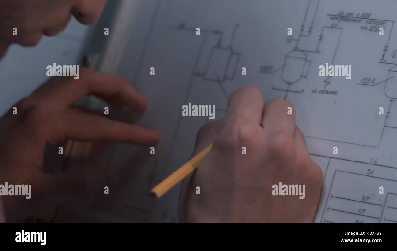 Close up of Architect hand sketching a construction project at work ...