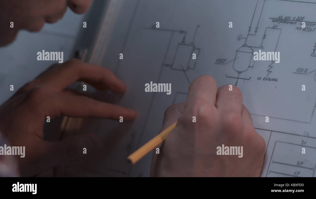 Close up of Architect hand sketching a construction project at work ...
