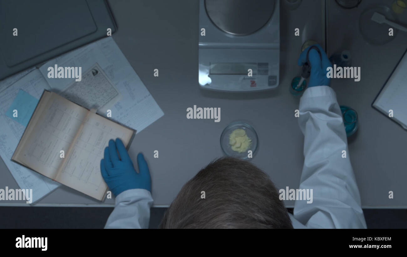 Chemical research in Petri dishes. Researcher preparing color plates in ...