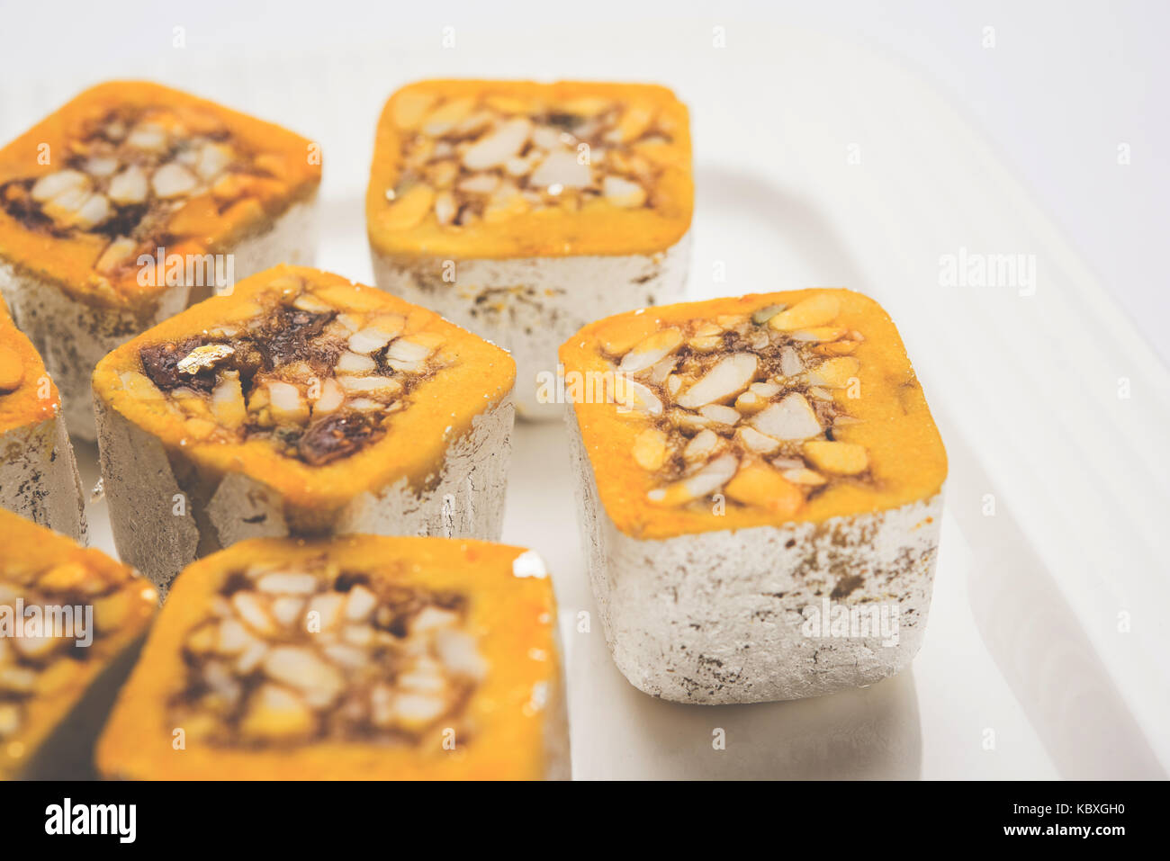 stock photo of sweet Mawa burfi for diwal wrapped with silver foili ...