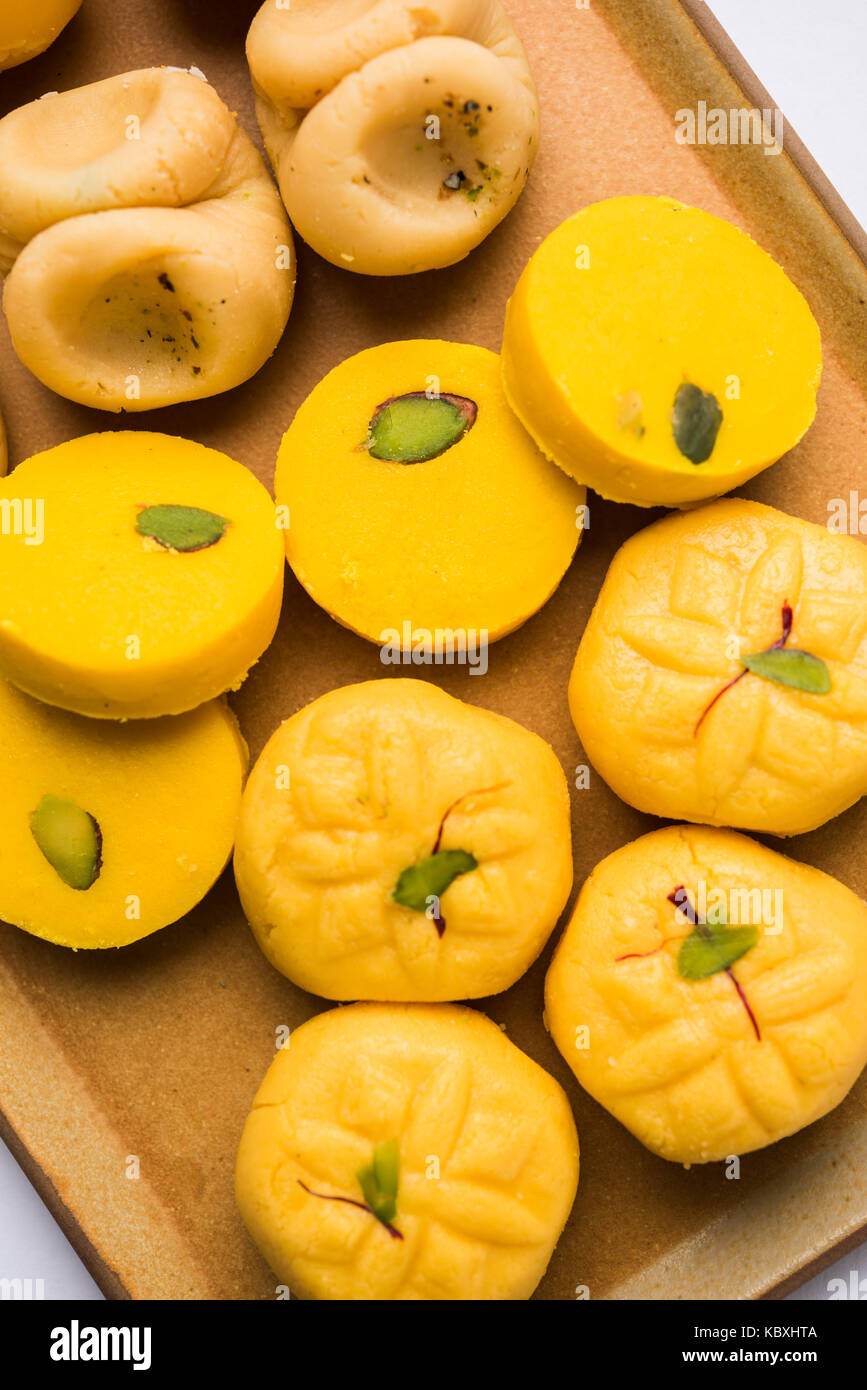 stock photo of collection of variety of sweets or orange peda or pedha ...