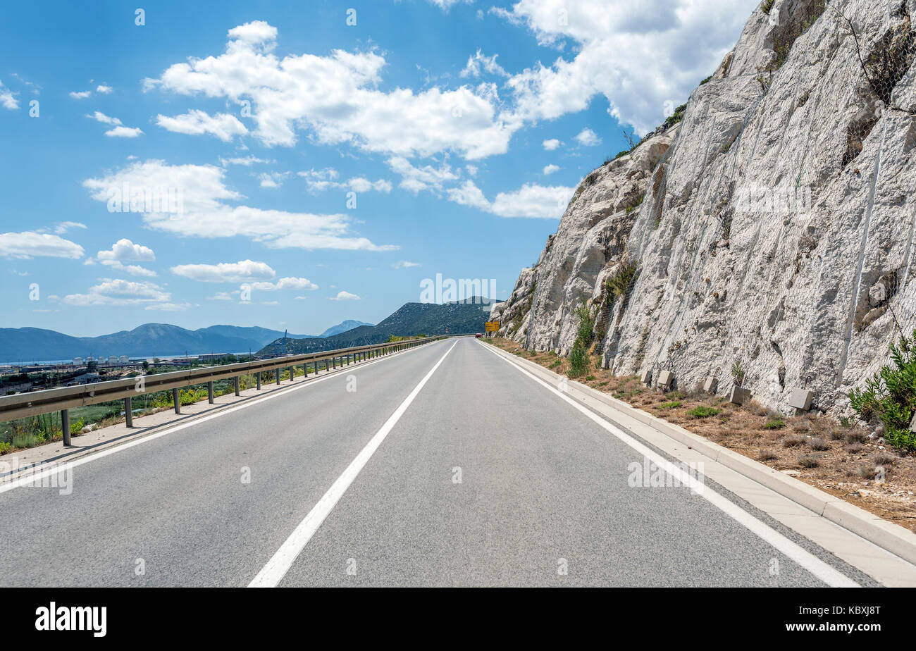 High-speed country road among the mountains Stock Photo - Alamy