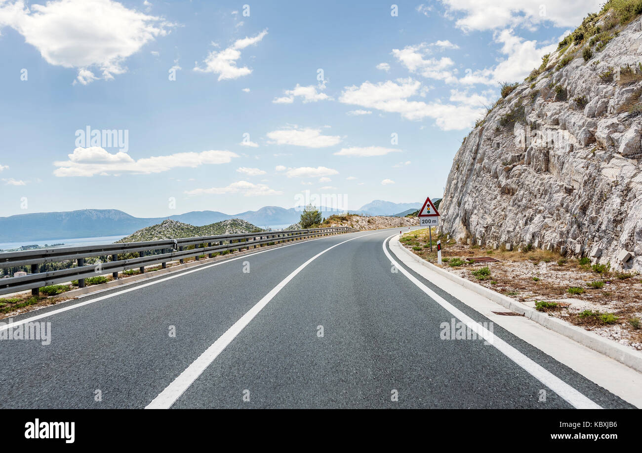 High-speed country road among the mountains Stock Photo - Alamy