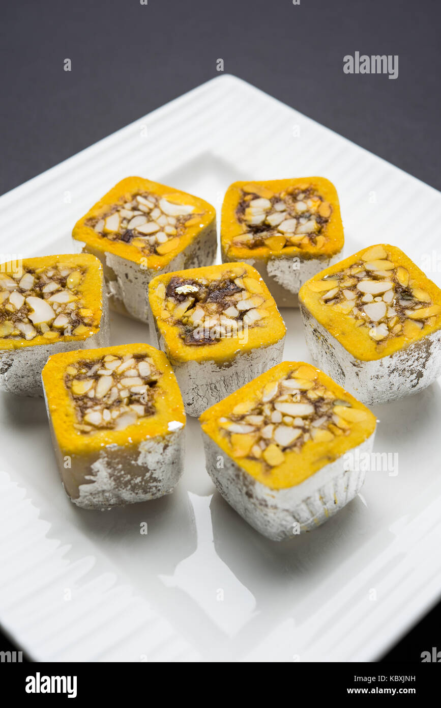 stock photo of sweet Mawa burfi for diwal wrapped with silver foili ...