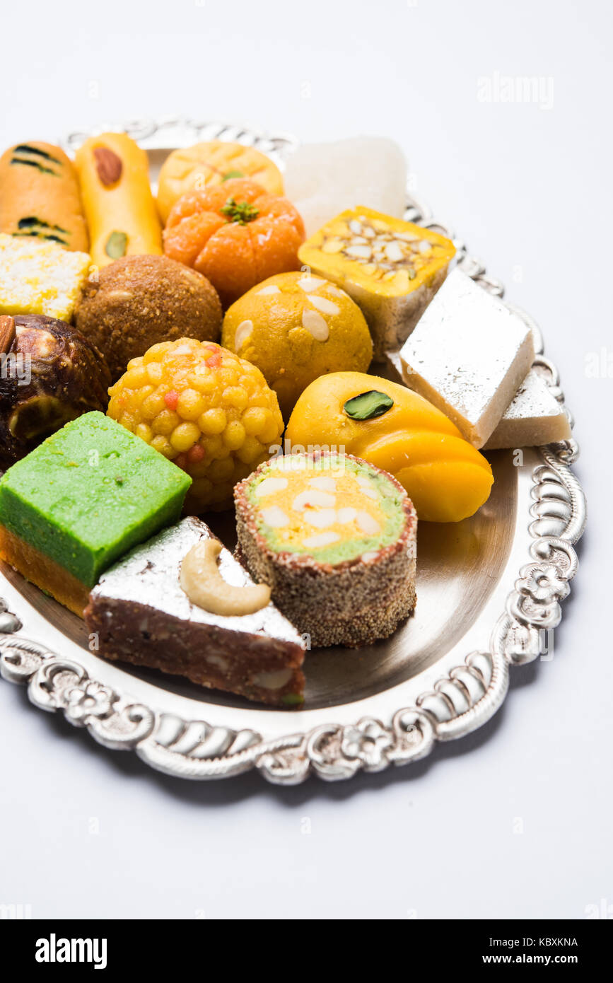 Stock photo of Indian sweets served in silver or wooden plate. variety ...