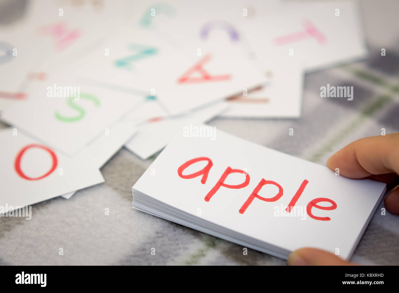 English; Learning the New Word with the Alphabet Cards Stock Photo - Alamy