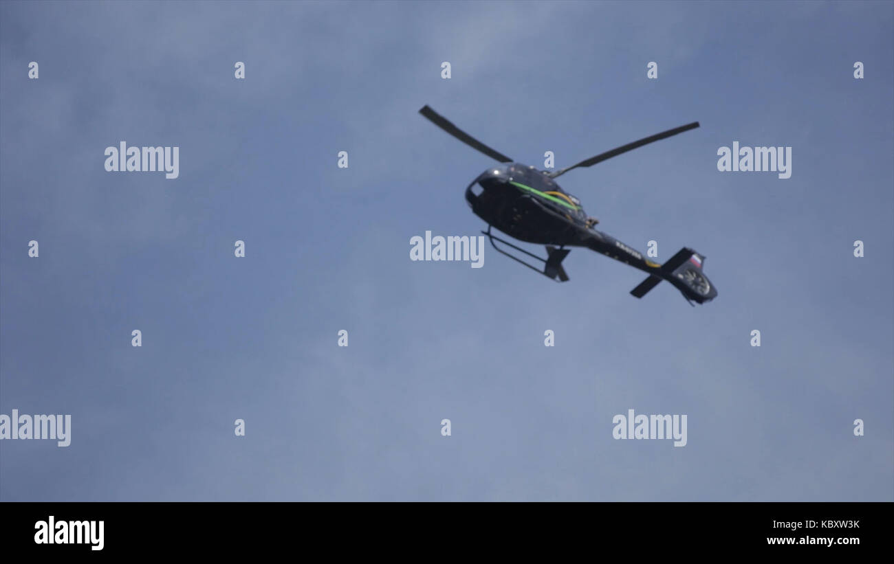 helicopter in the cloudy sky with lightning. Helicopter From Below ...