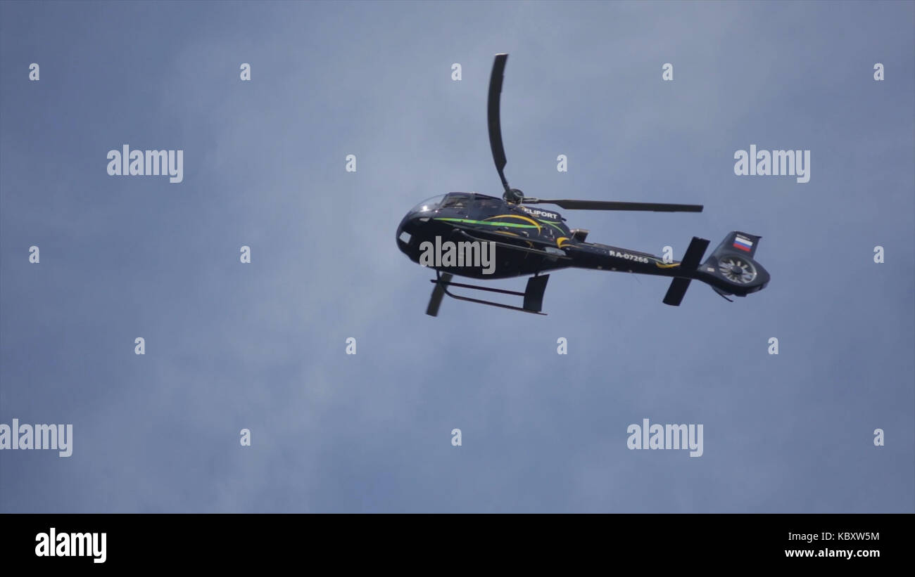 helicopter in the cloudy sky with lightning. Helicopter From Below ...