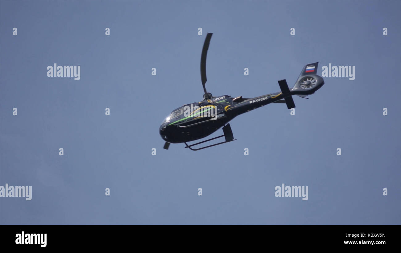 helicopter in the cloudy sky with lightning. Helicopter From Below ...