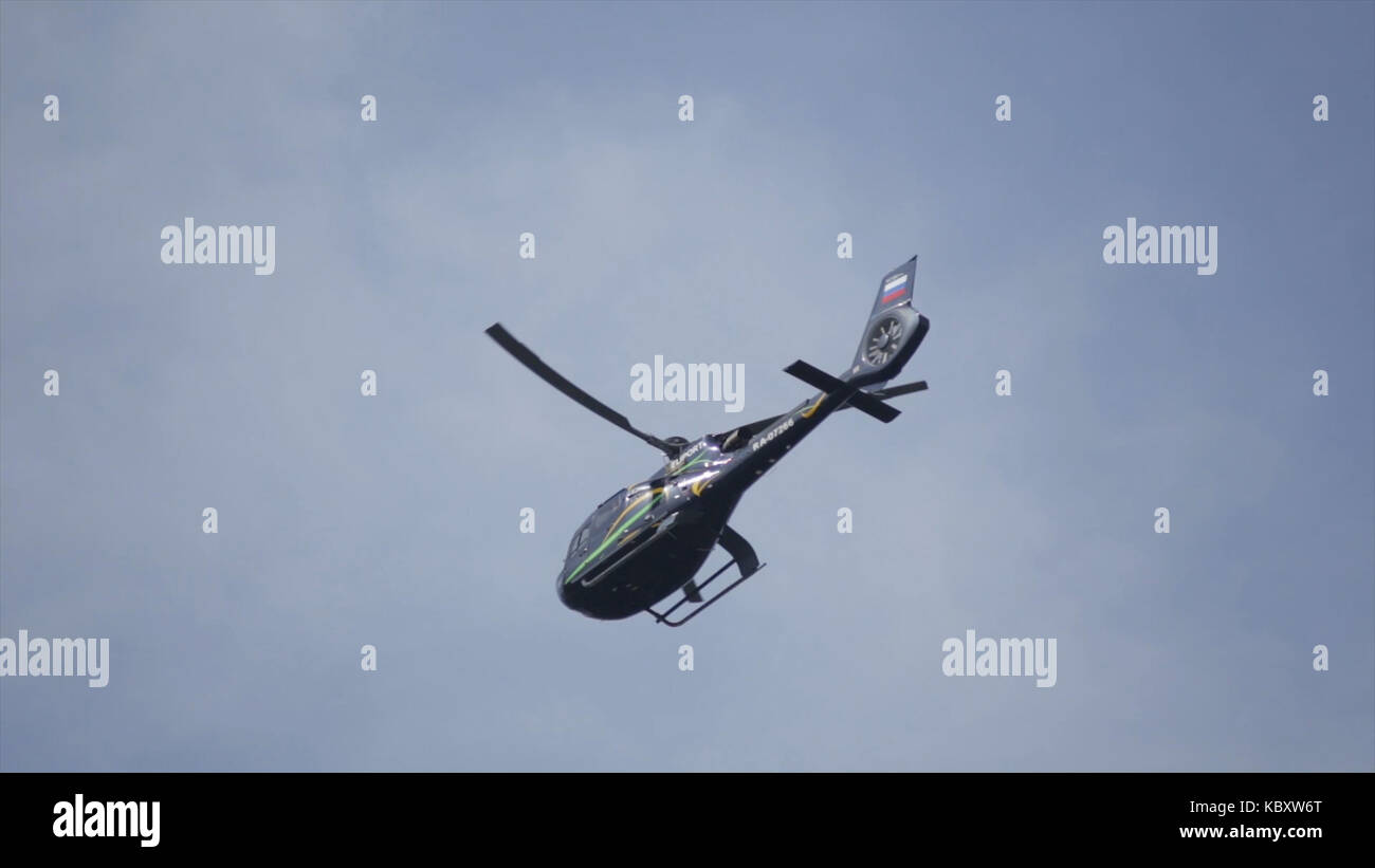 helicopter in the cloudy sky with lightning. Helicopter From Below ...