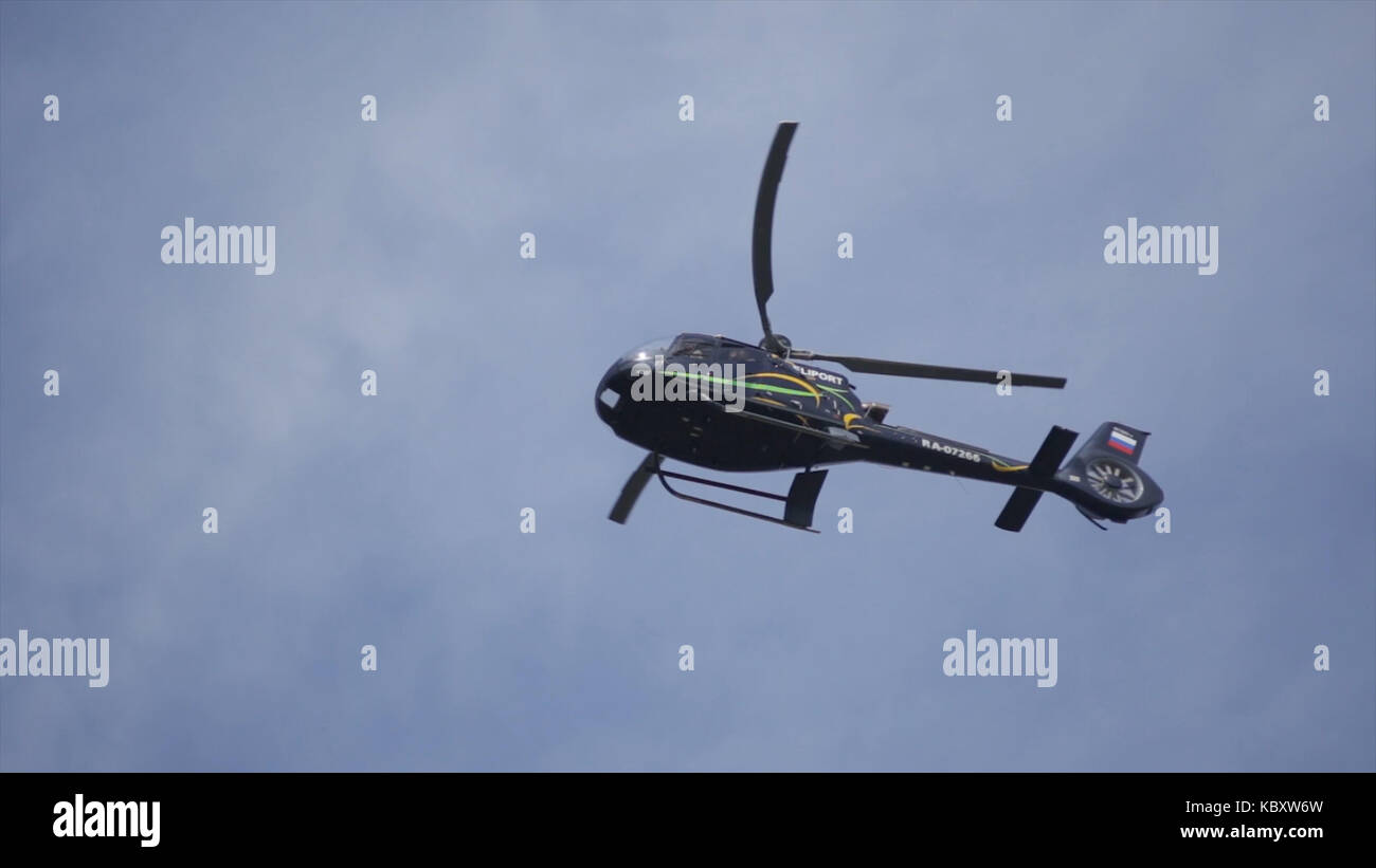 helicopter in the cloudy sky with lightning. Helicopter From Below ...