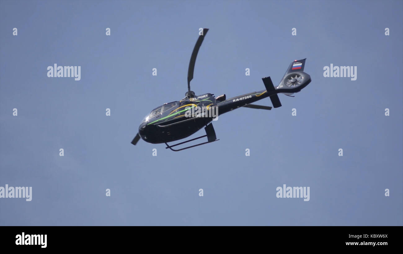 helicopter in the cloudy sky with lightning. Helicopter From Below ...