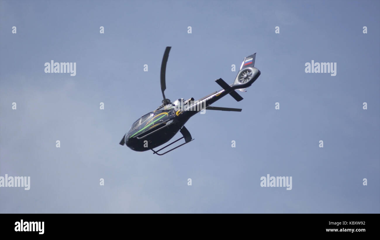 helicopter in the cloudy sky with lightning. Helicopter From Below ...