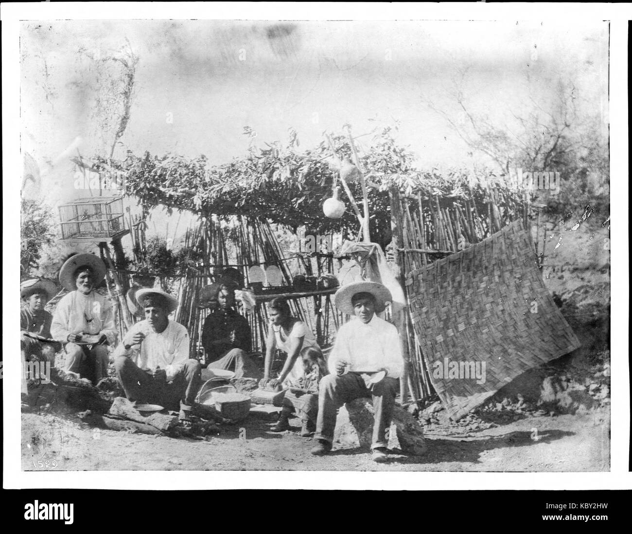 This early 20th-century photograph depicts a group of Yaqui Indians ...