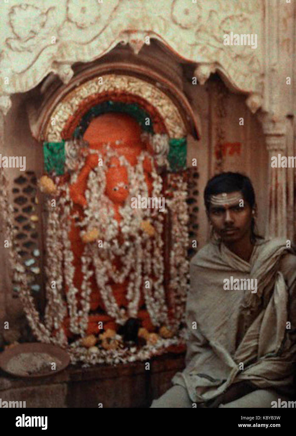 A Hindu priest sits in front of his temple in 1923 Stock Photo - Alamy
