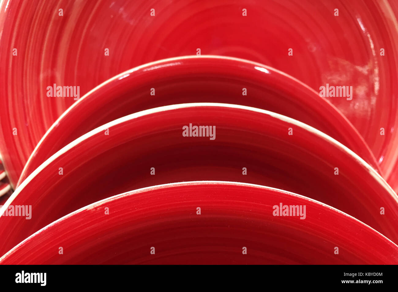 Stack of red ceramic plate dishes Stock Photo - Alamy