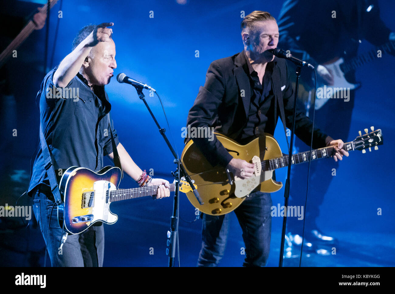 Bruce Springsteen (left) and Bryan Adams (right) perform during the ...