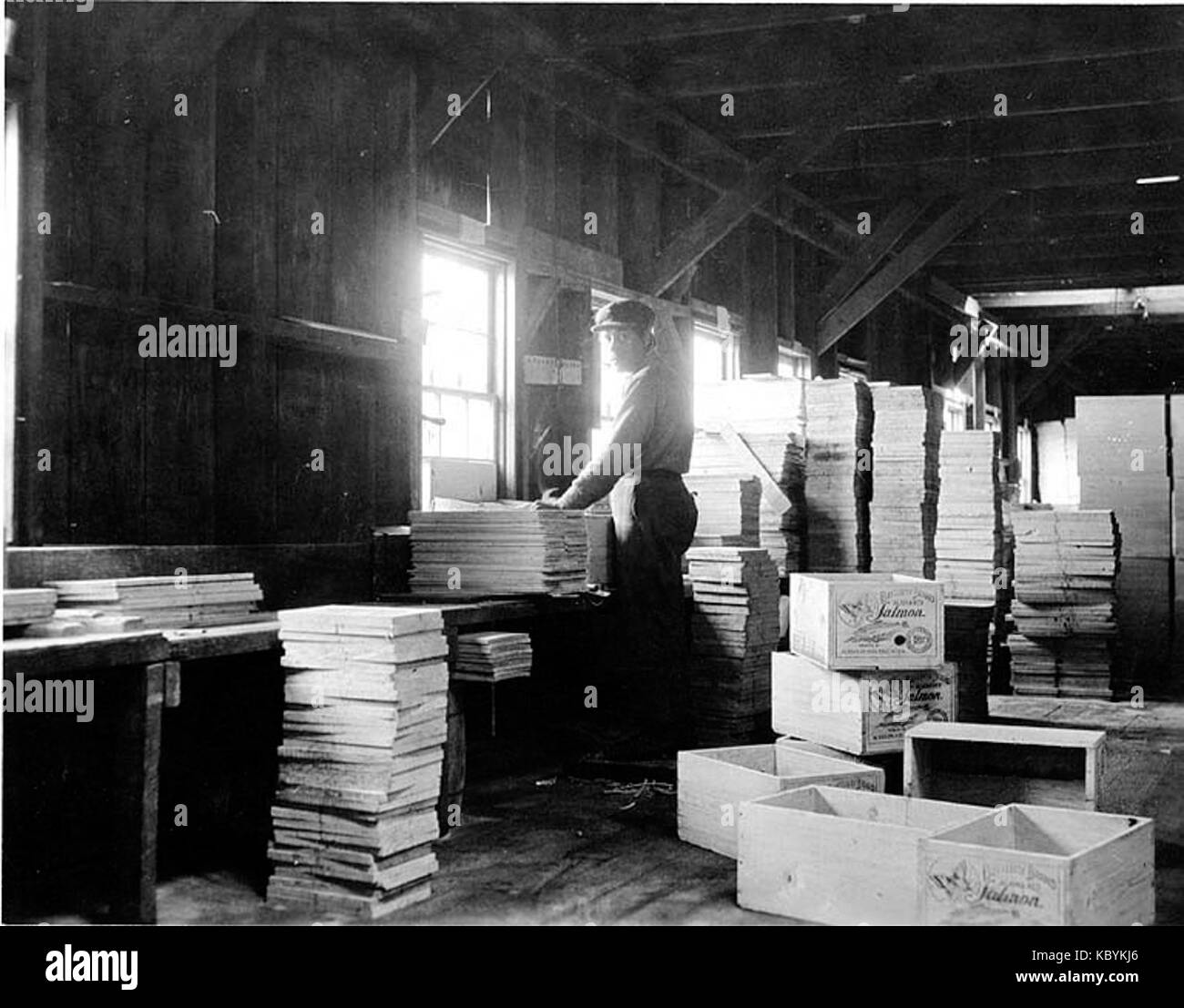 Cannery worker making boxes, Clarks Point, Nushagak Bay, Alaska, 1918 ...
